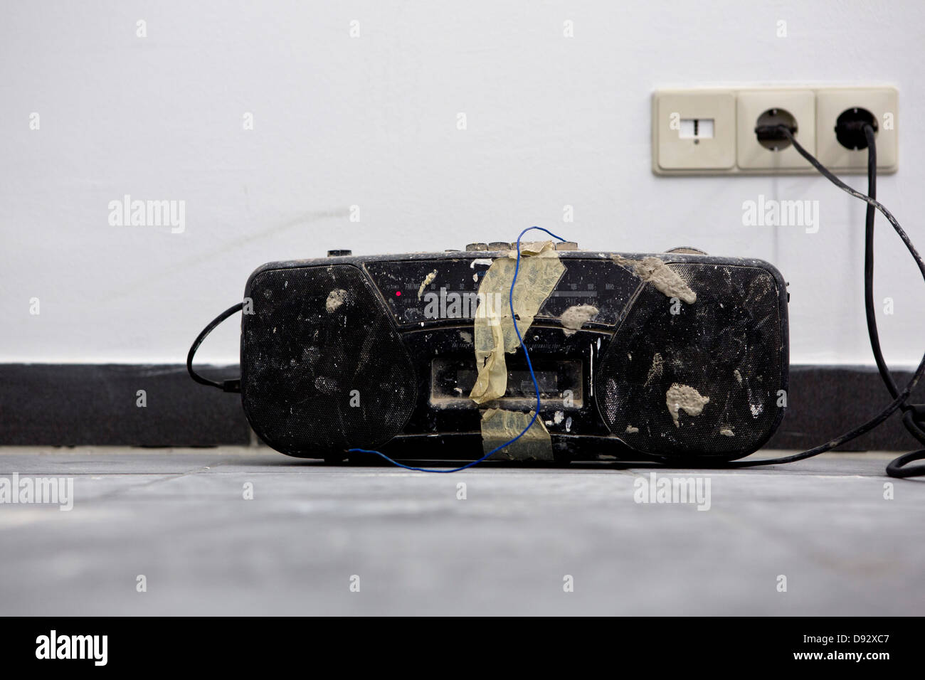 An old battered boom box plugged into a wall Stock Photo - Alamy
