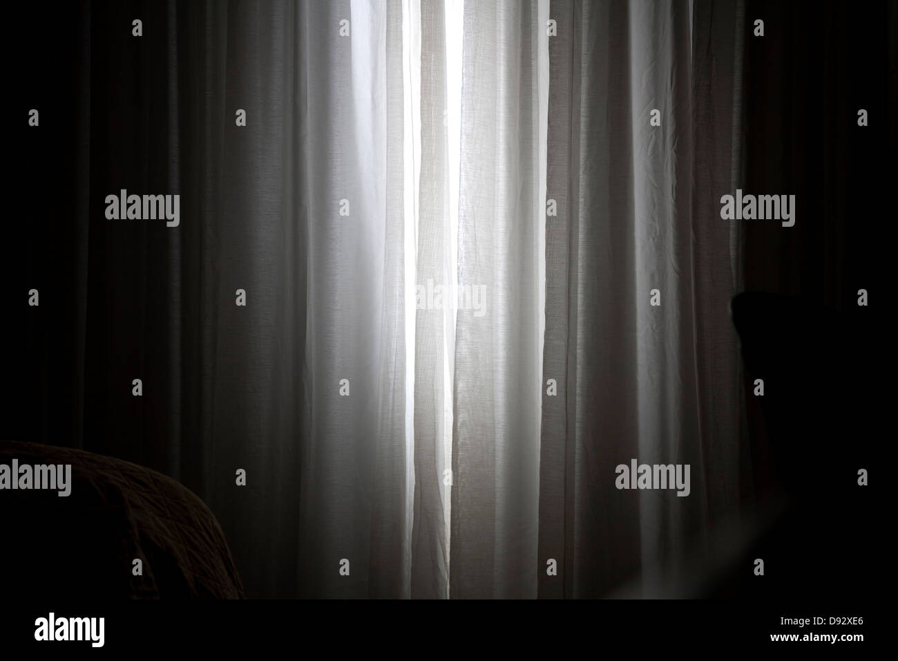 Sunlight coming in through slightly parted curtains in a bedroom Stock ...
