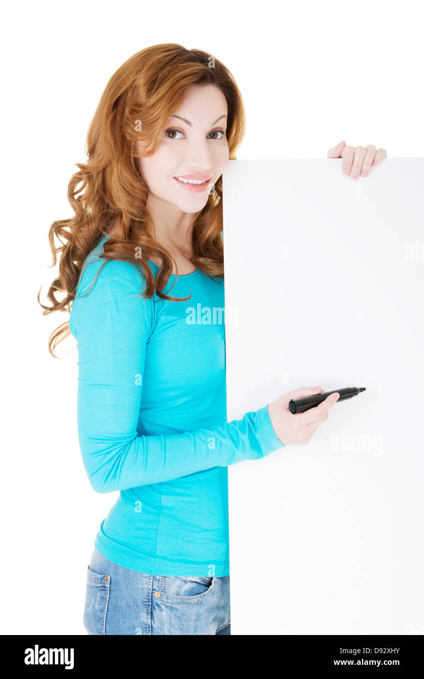 Happy beautiful woman writing with a marker on blank board. Student ...