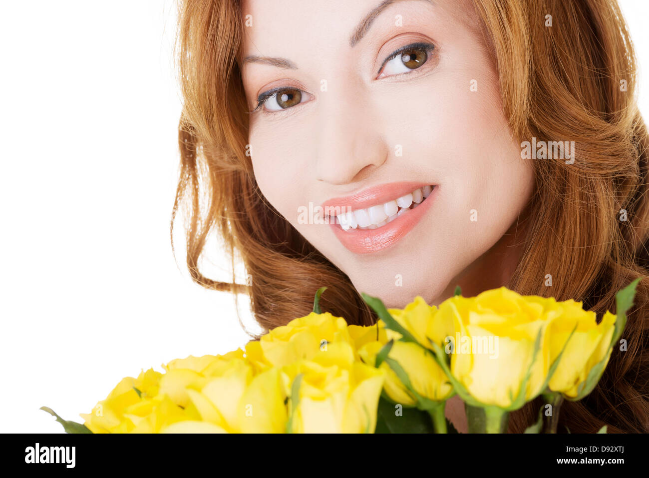 Happy woman with fresh yellow roses Stock Photo - Alamy