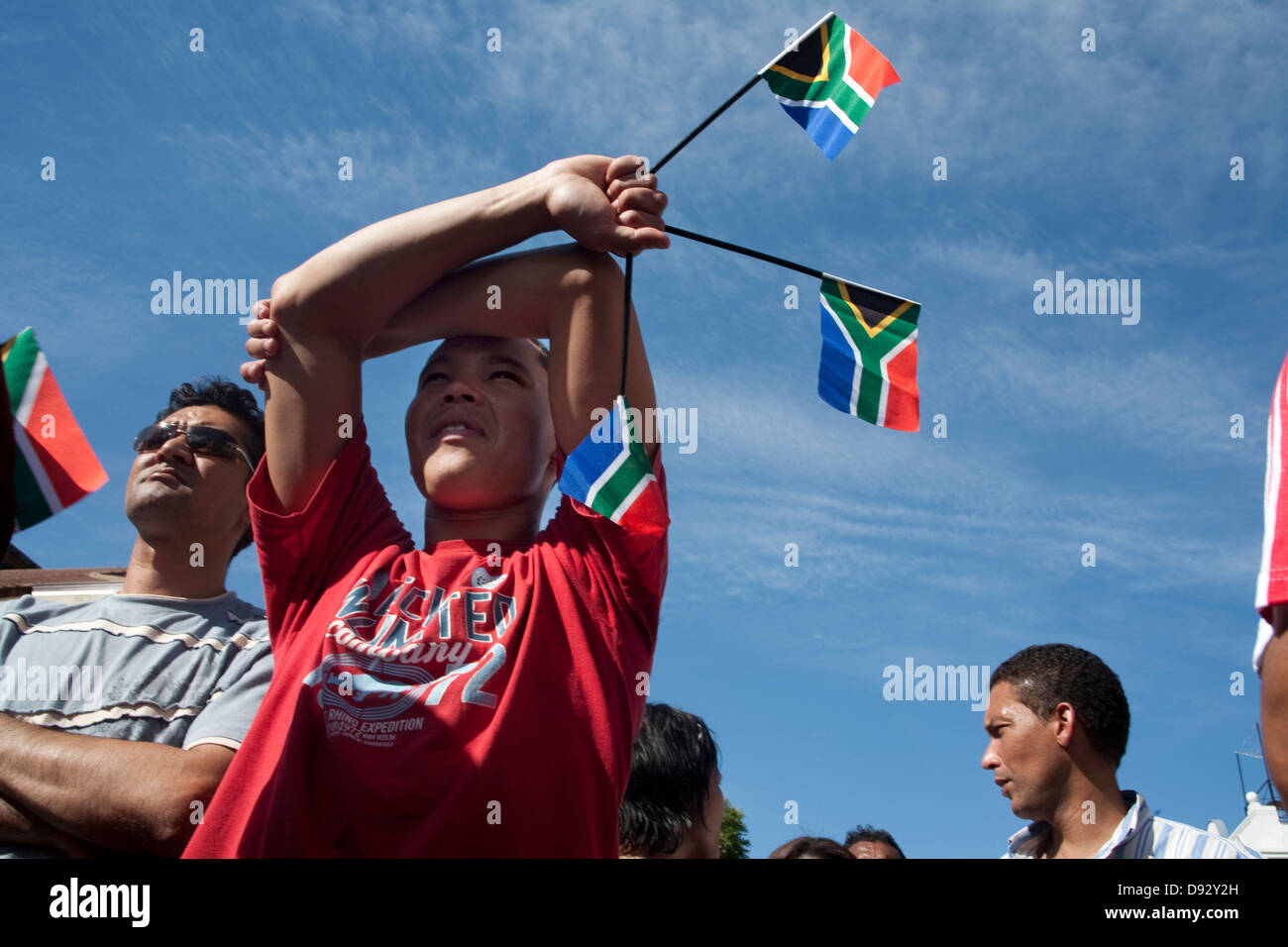 South African football fan holding 3 South African flags in hand as ...