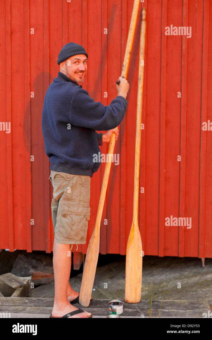 Man painting oar Stock Photo - Alamy