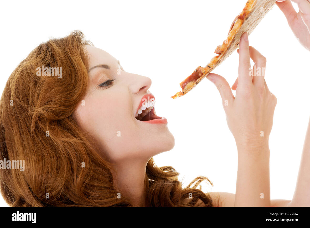 Happy woman eating pizza. Over white background Stock Photo - Alamy
