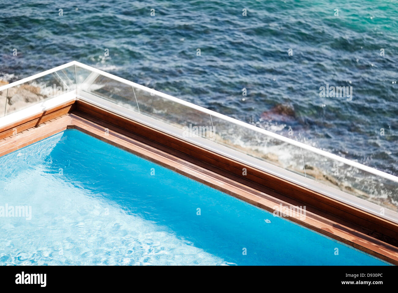 View of swimming pool and sea Stock Photo - Alamy