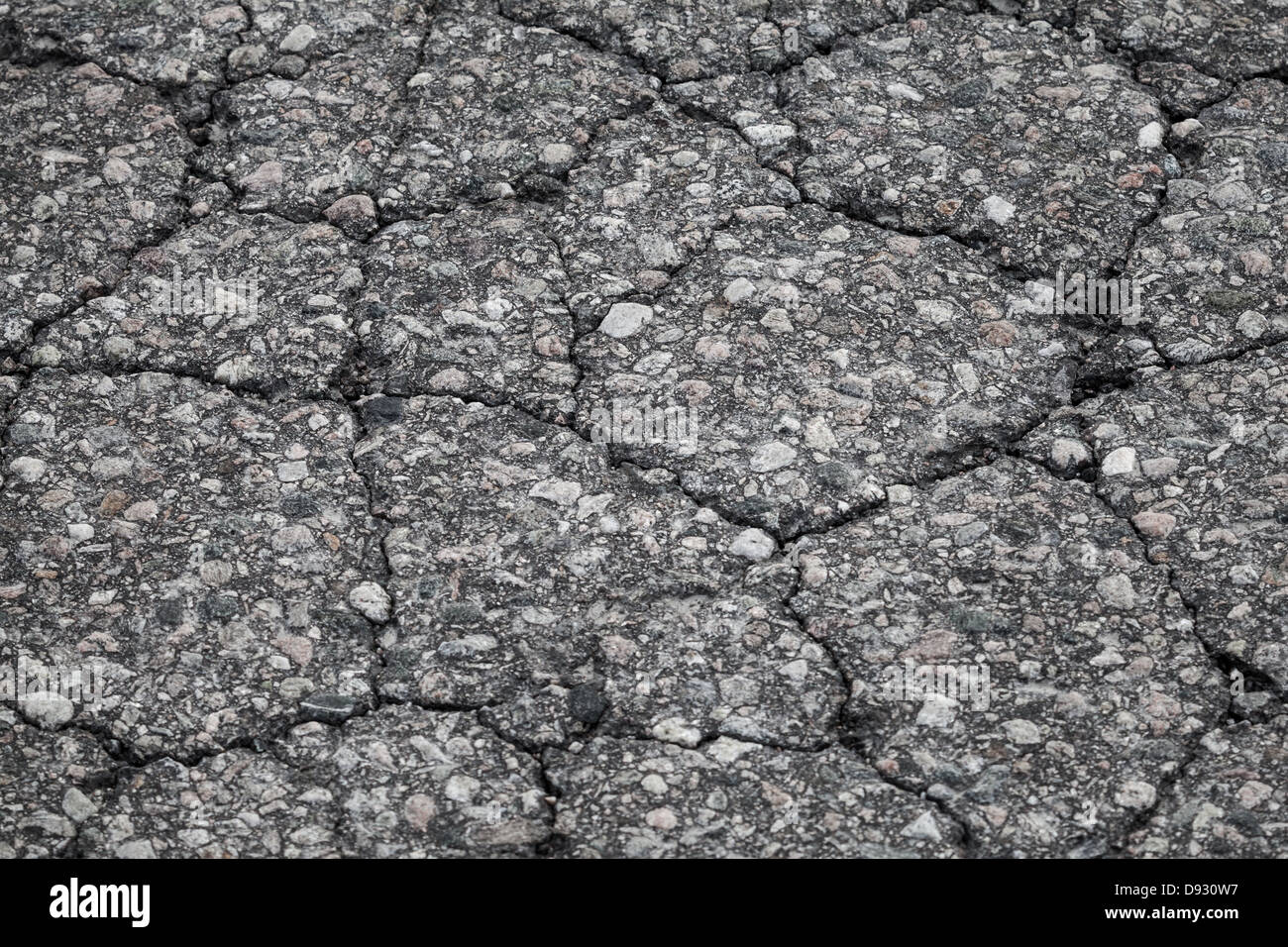 Damaged asphalt road macro texture Stock Photo - Alamy