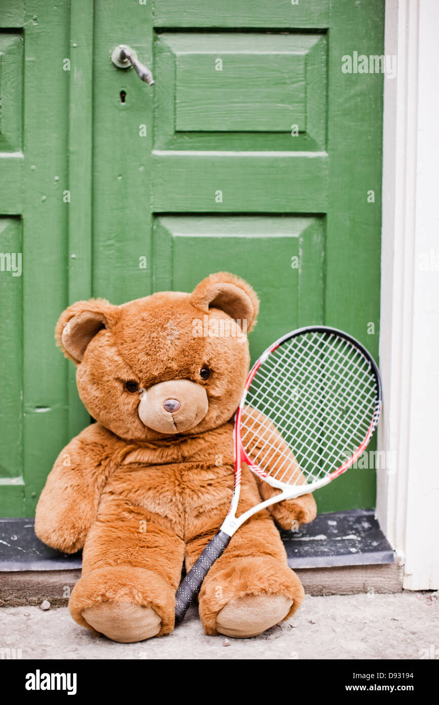 Teddy bear with tennis rocket Stock Photo - Alamy