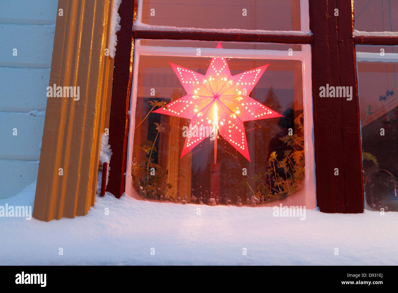 Christmas star decoration in window of house Stock Photo - Alamy