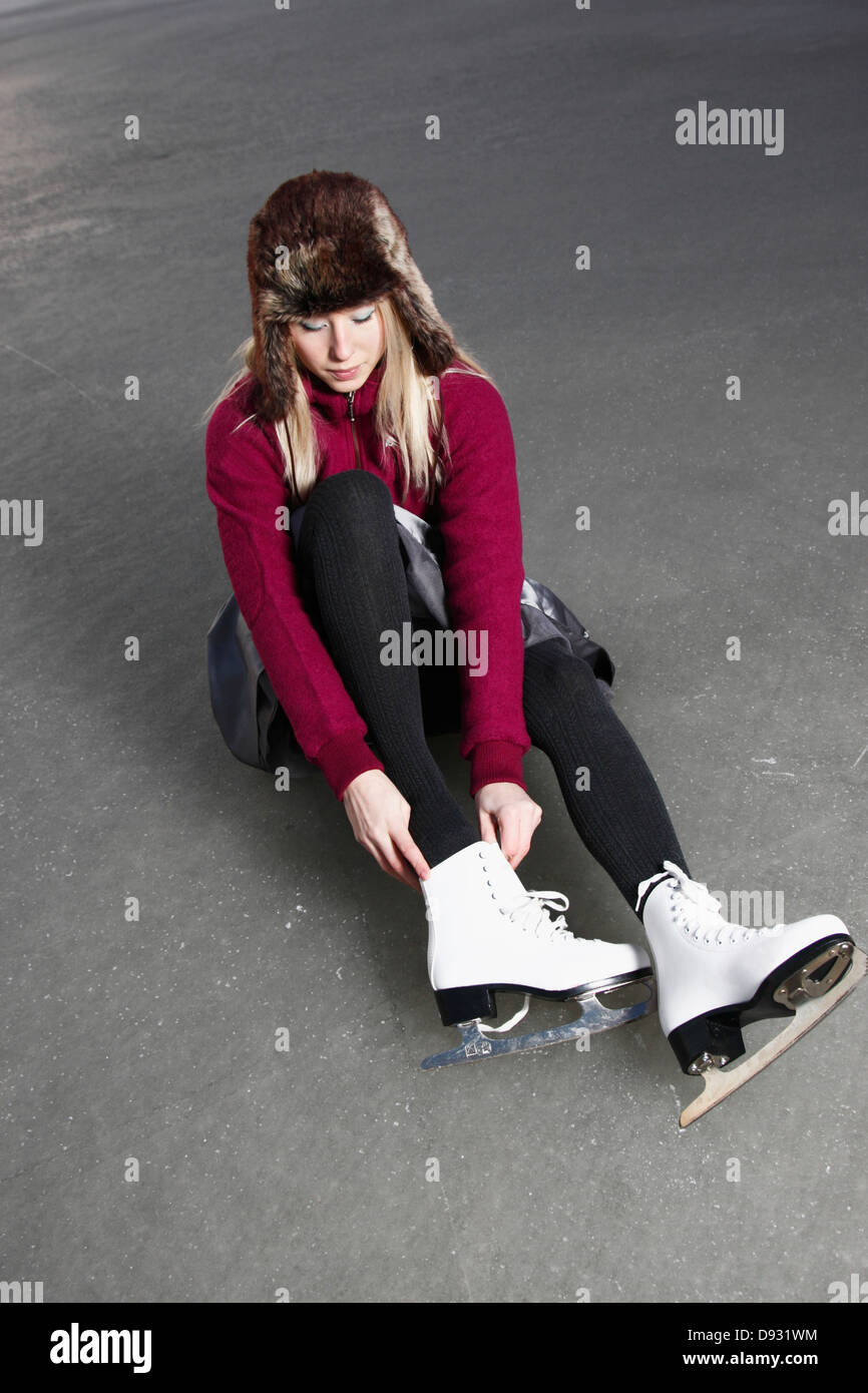 Putting on ice skates hi-res stock photography and images - Alamy