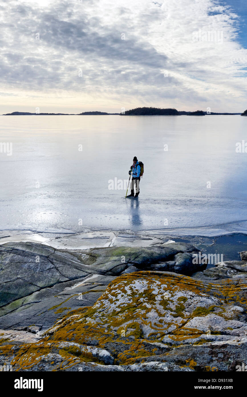 Person skating at frozen sea Stock Photo - Alamy