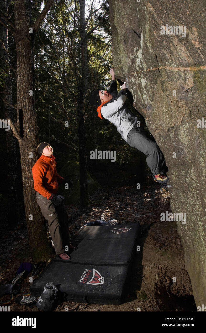 Woman on difficult rock hi-res stock photography and images - Alamy