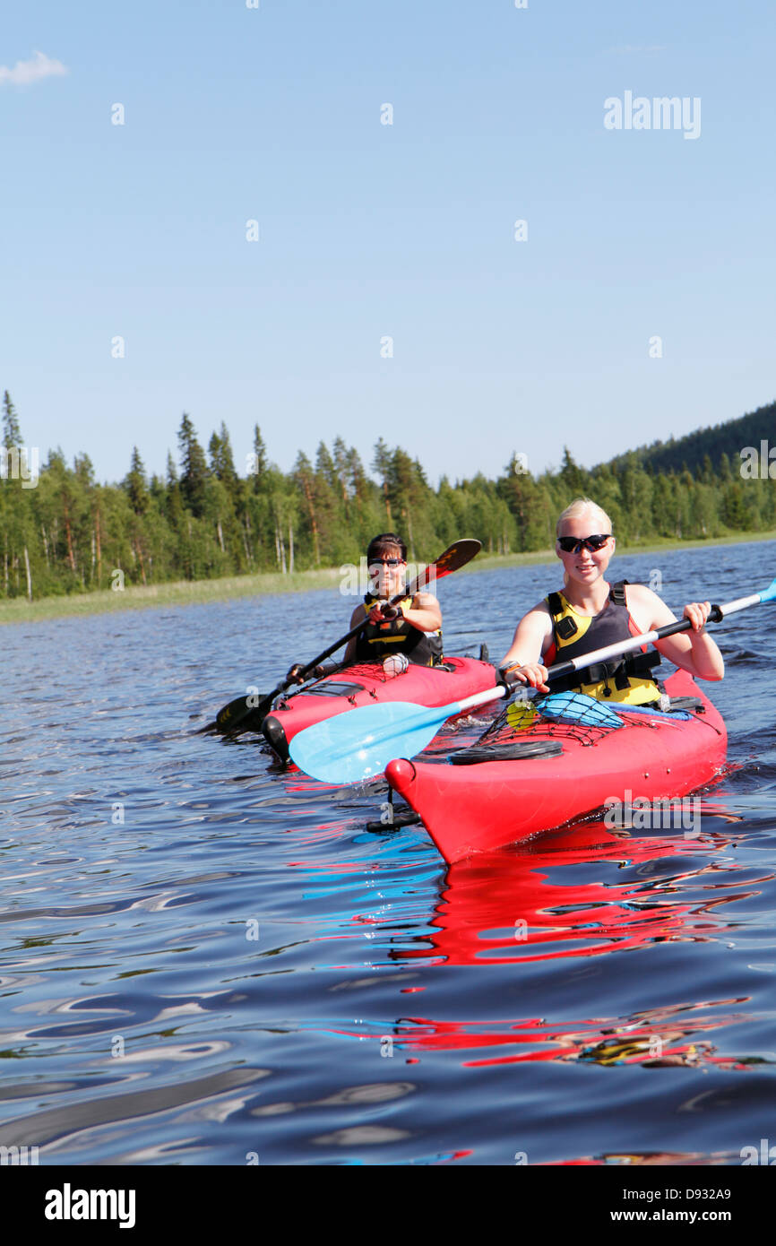 Women kayaking on lake Stock Photo - Alamy