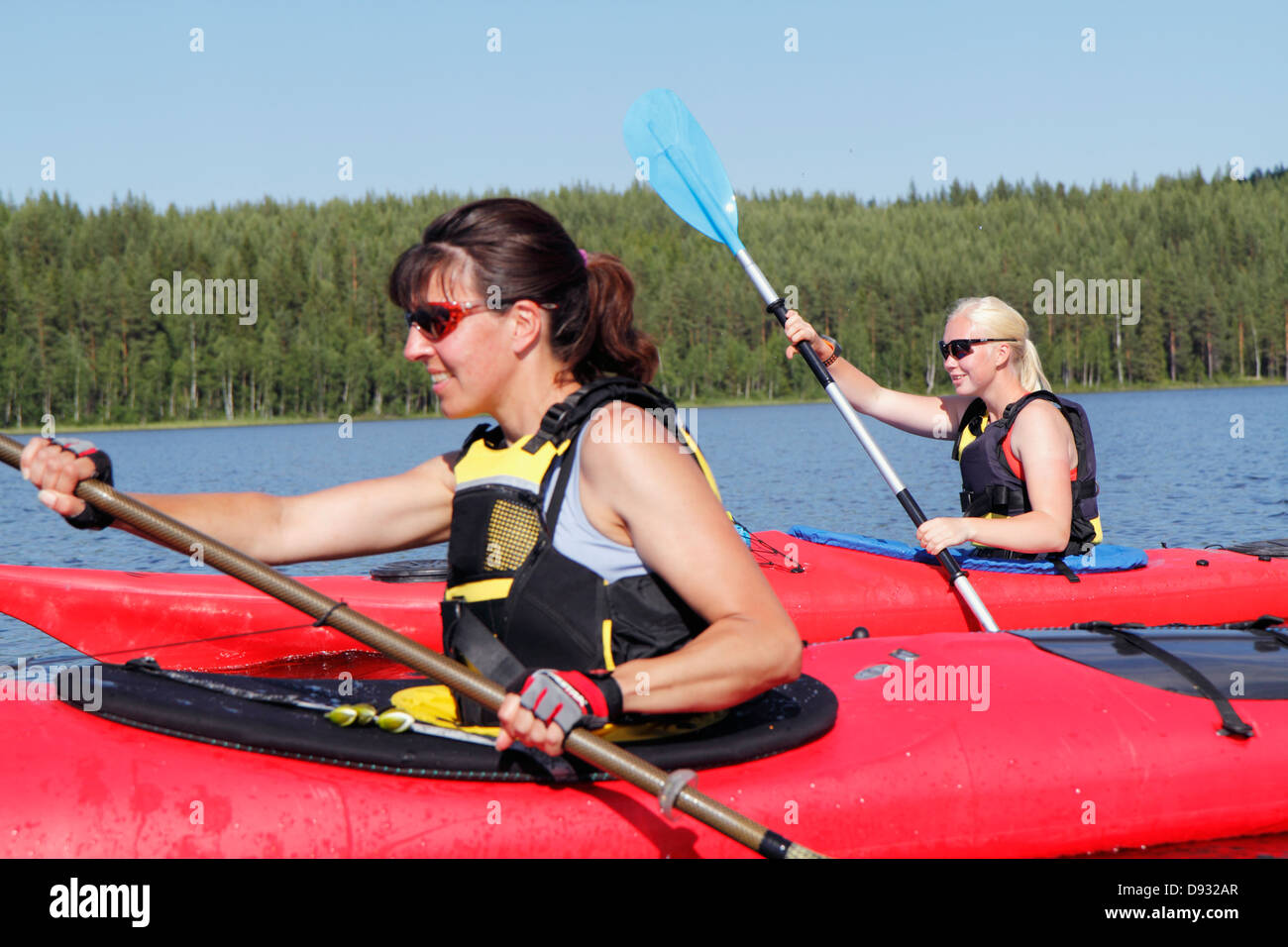 Women kayaking on lake Stock Photo - Alamy
