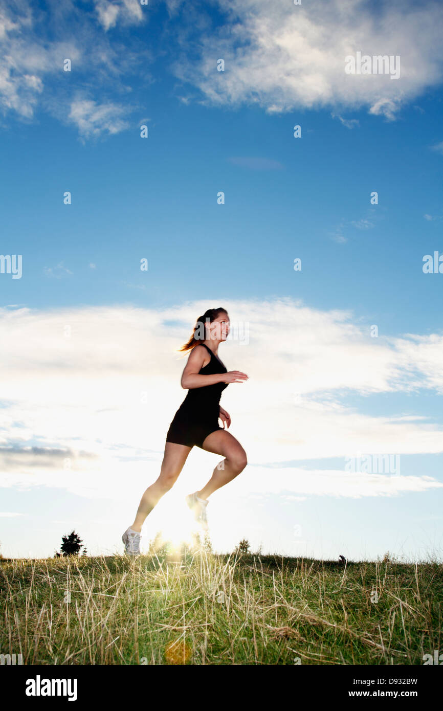 Woman running hi-res stock photography and images - Alamy