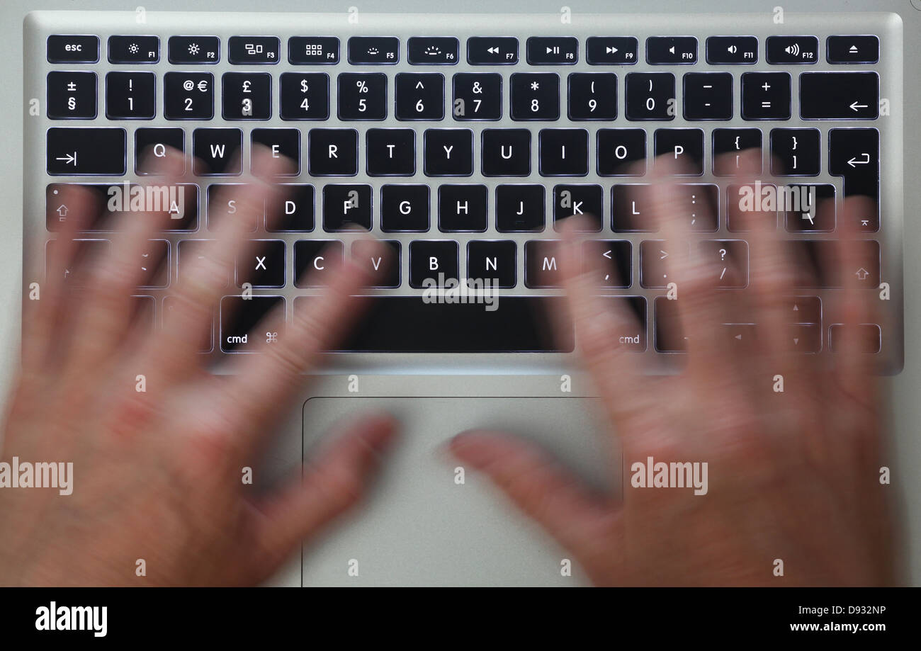 Hands on a Apple Macbook pro laptop Computer keyboard Stock Photo - Alamy