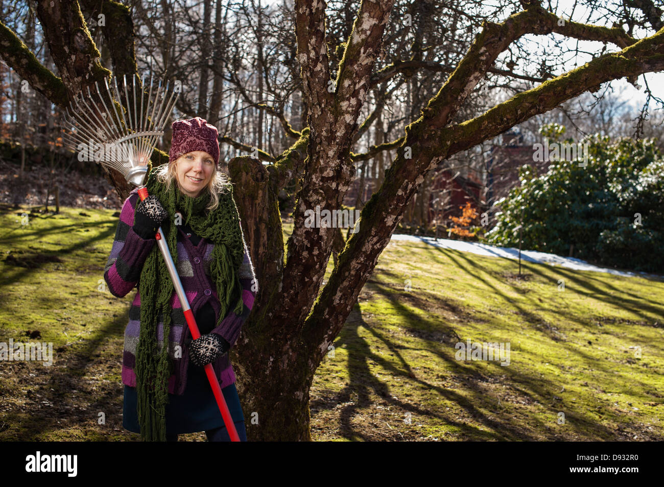Woman with rake hi-res stock photography and images - Alamy