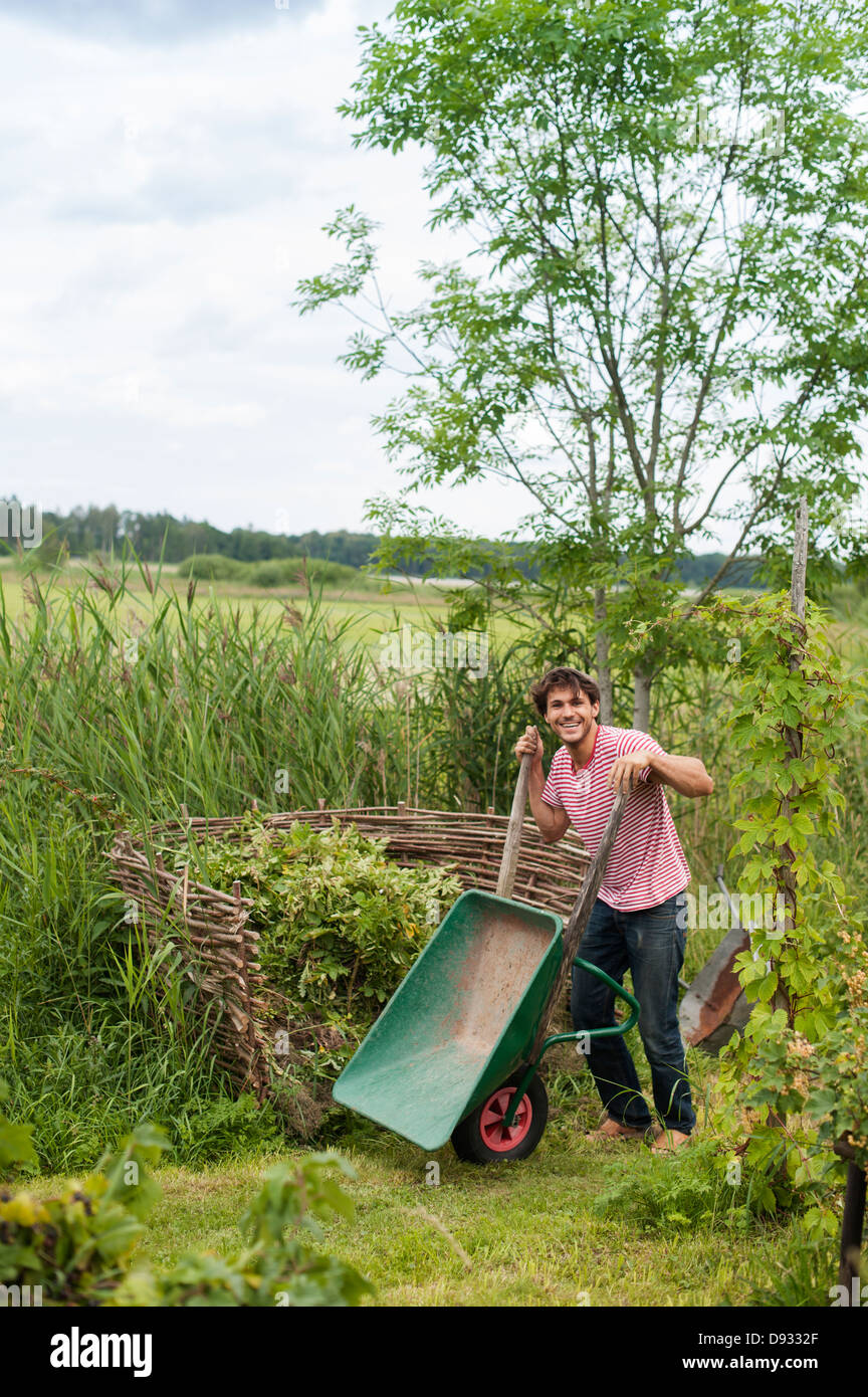 Man with barrow hi-res stock photography and images - Alamy