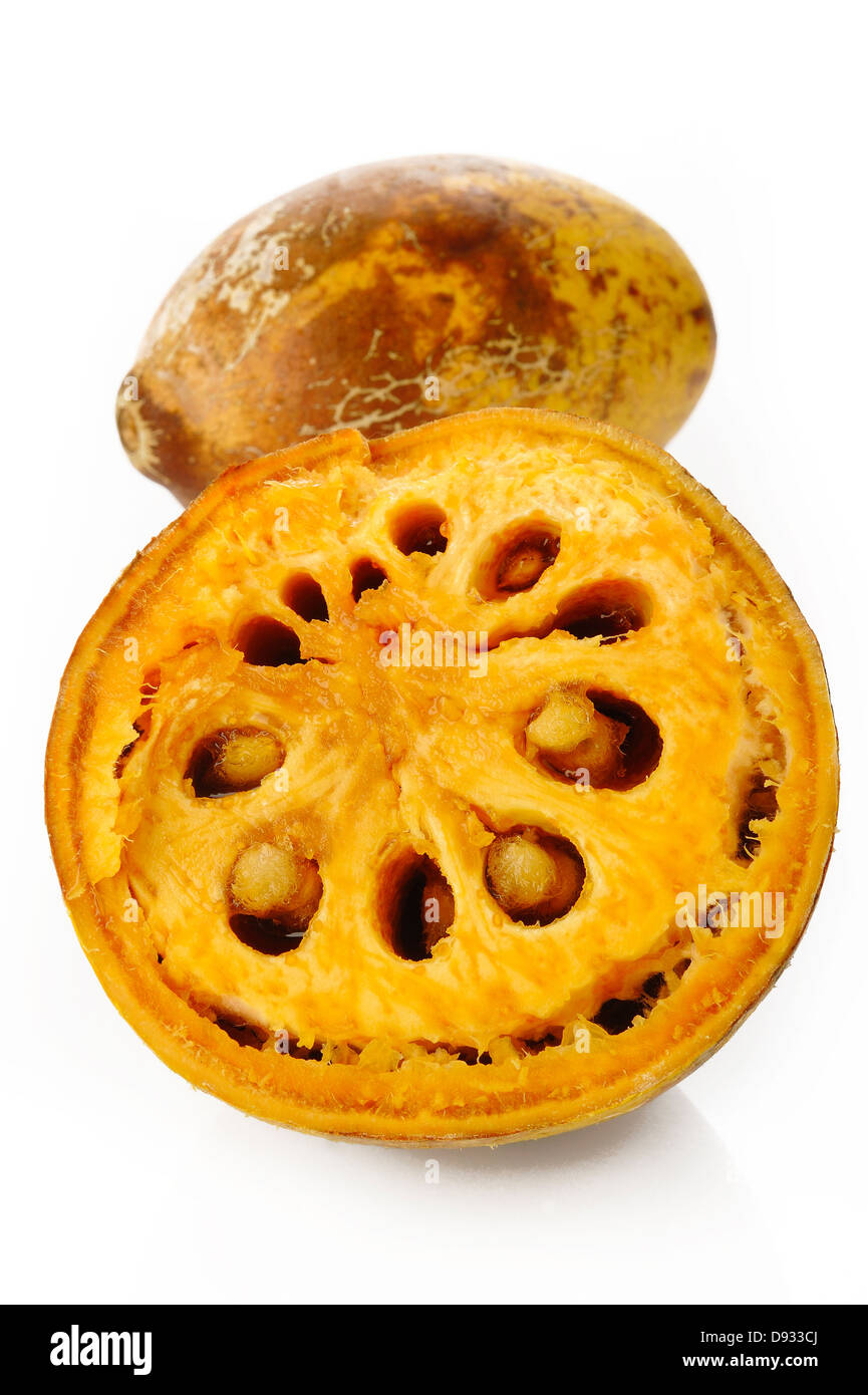 ripe bael fruit on white background Stock Photo - Alamy