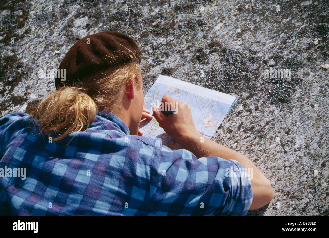 Man searching in map Stock Photo - Alamy