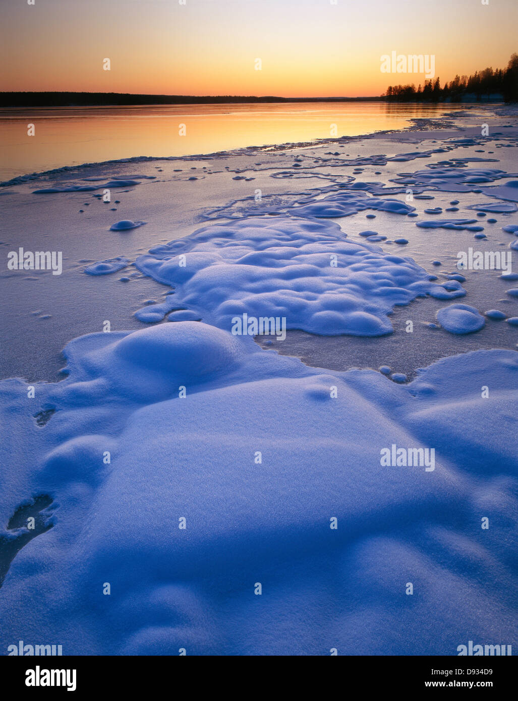 Snow melting near sea Stock Photo - Alamy