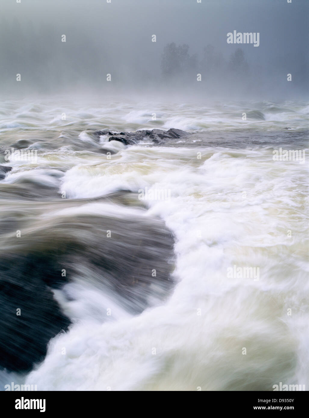Rocks in ocean Stock Photo - Alamy