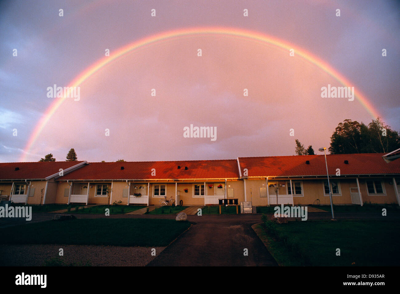 Rainbow over a terrace-house Stock Photo - Alamy