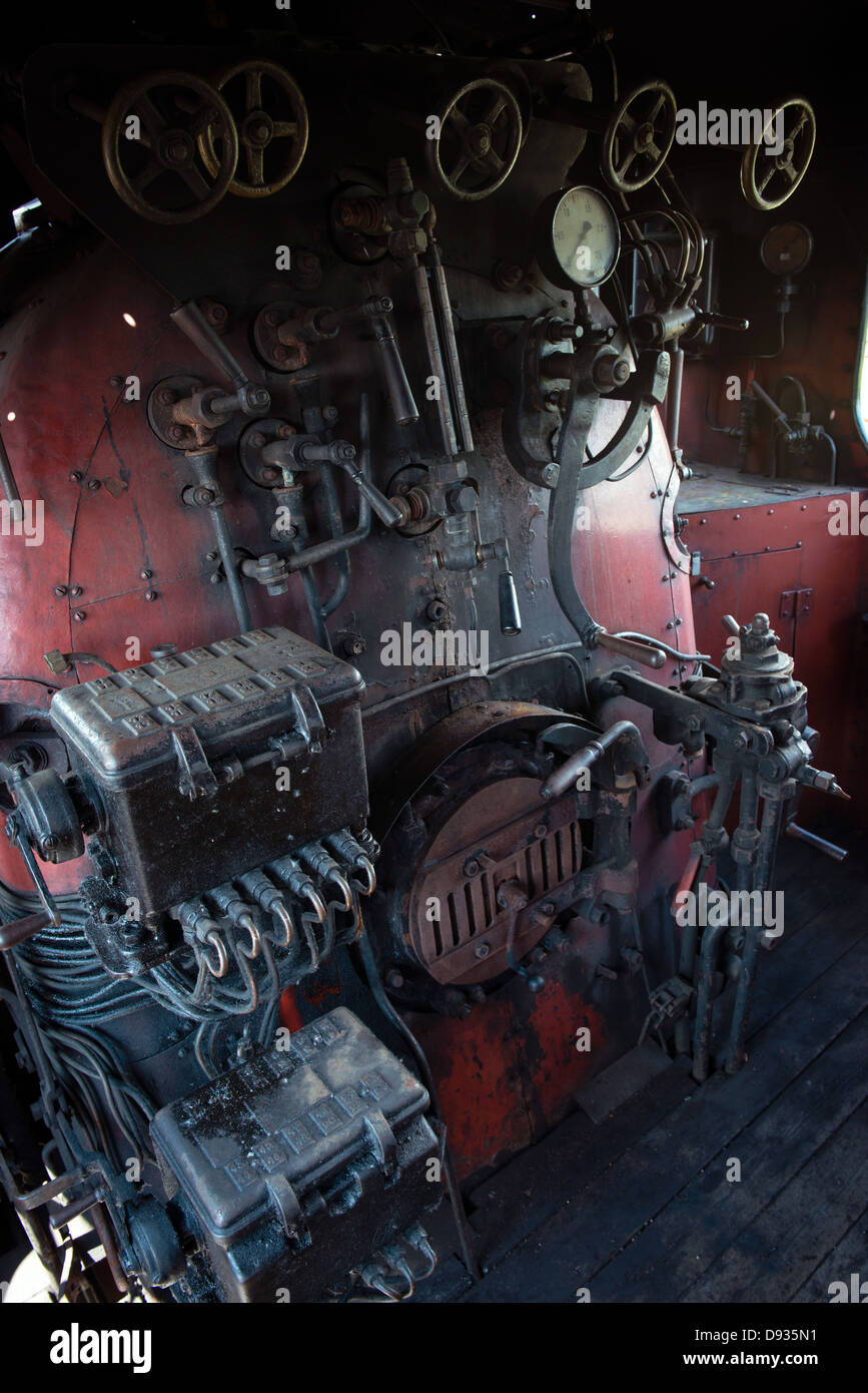Controls in dark engine room of steam locomotive Stock Photo - Alamy