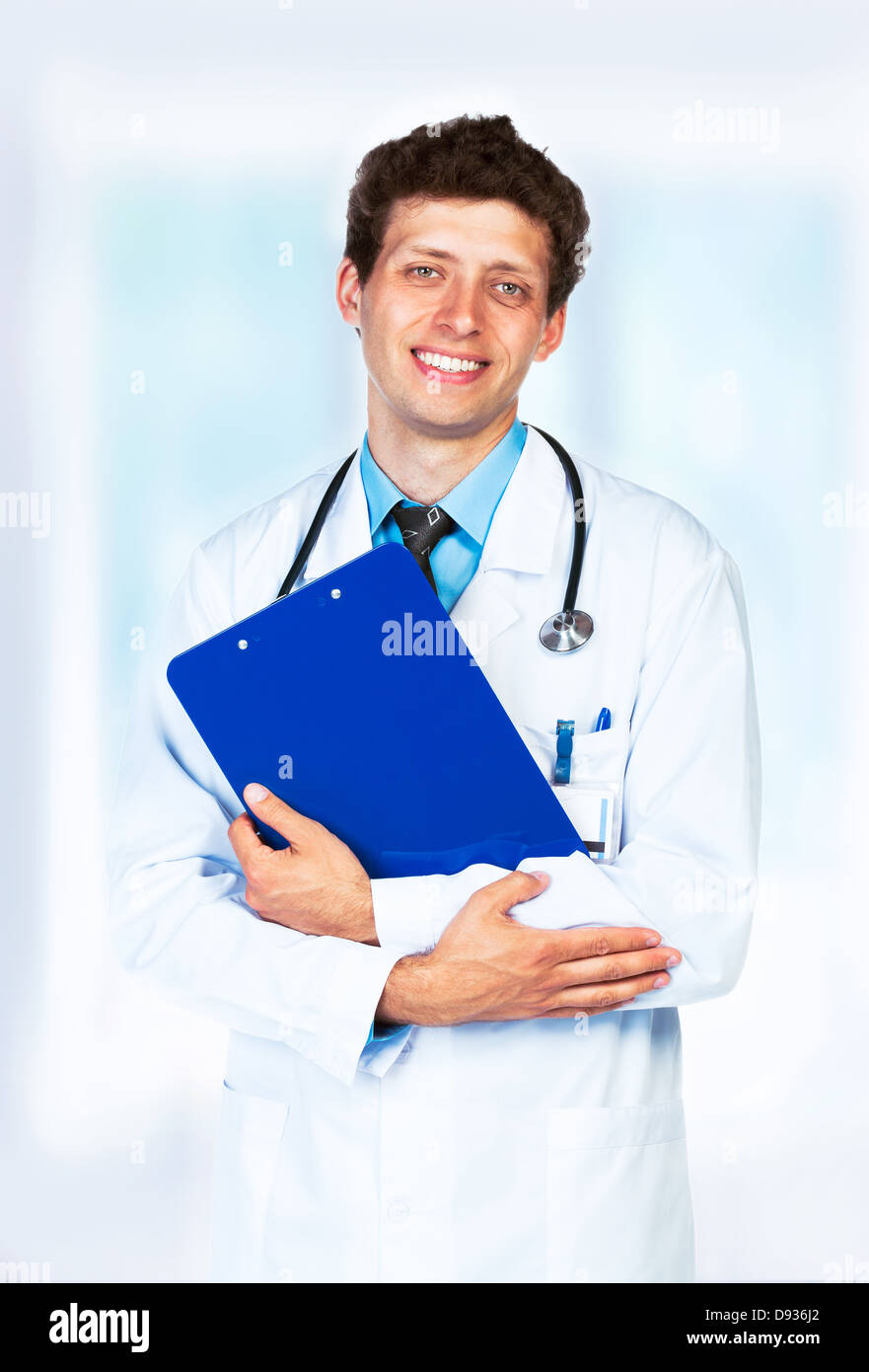 Portrait of the smiling doctor on interior background Stock Photo - Alamy