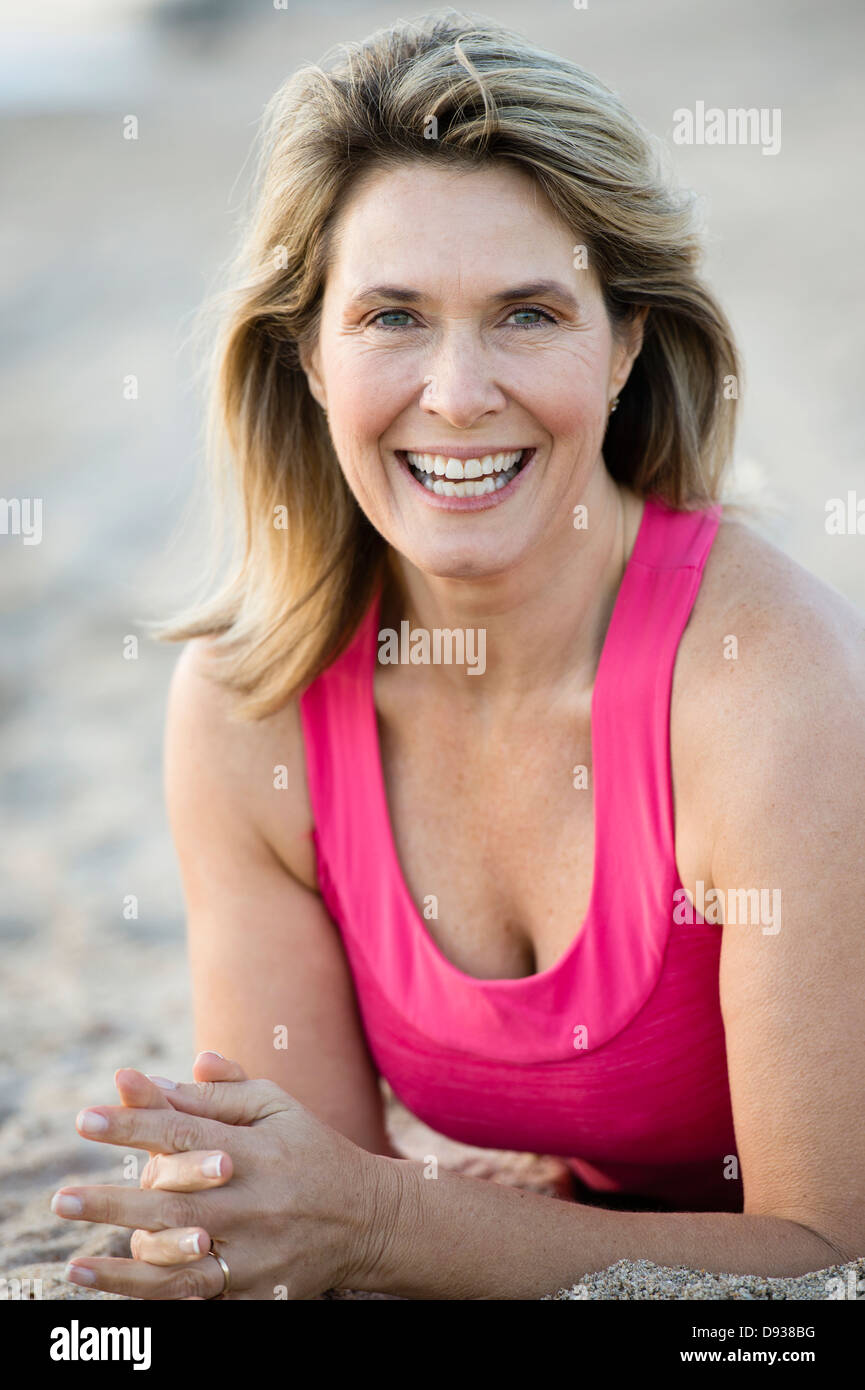 Woman laying on beach blonde hi-res stock photography and images - Alamy