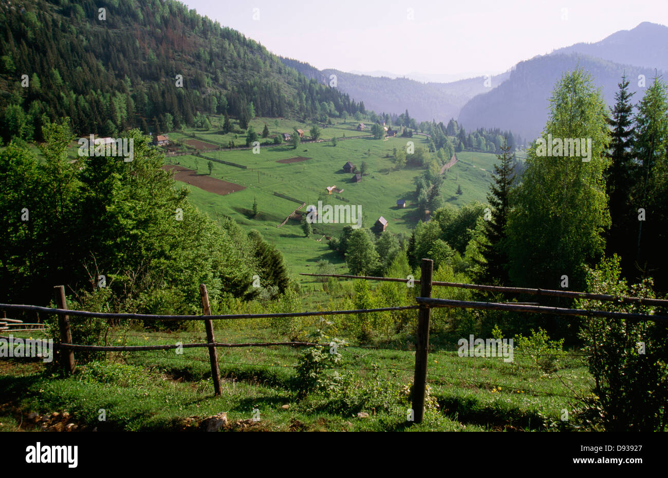 View of rural landscape with mountains in background Stock Photo - Alamy