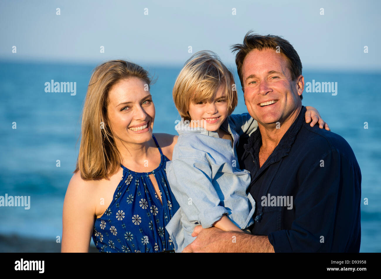 Smiling bonding looking away standing childhood hi-res stock ...