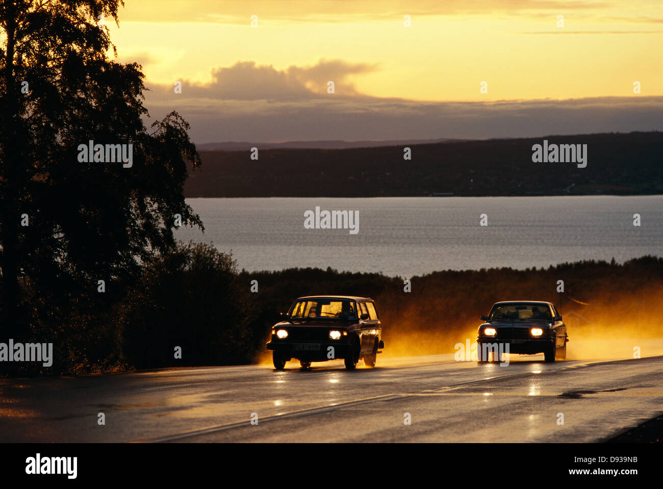 Two cars on a wet countryside Stock Photo - Alamy