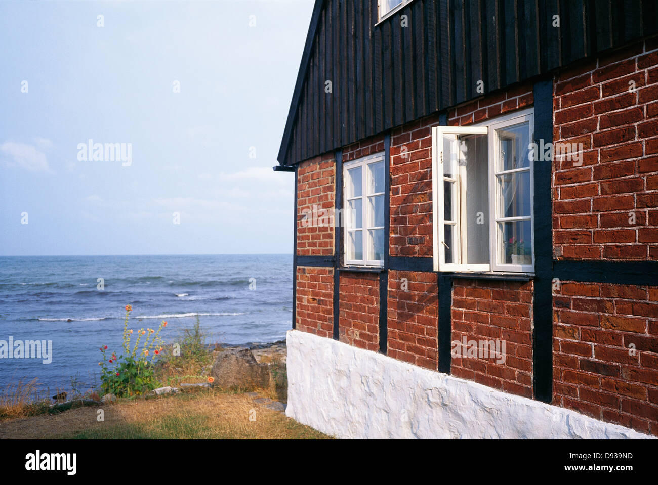 A house with windows facing the sea Stock Photo - Alamy