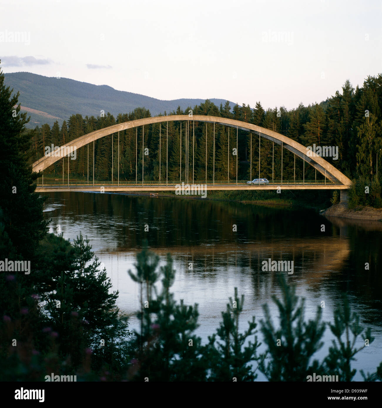 A bridge over a calm river Stock Photo - Alamy