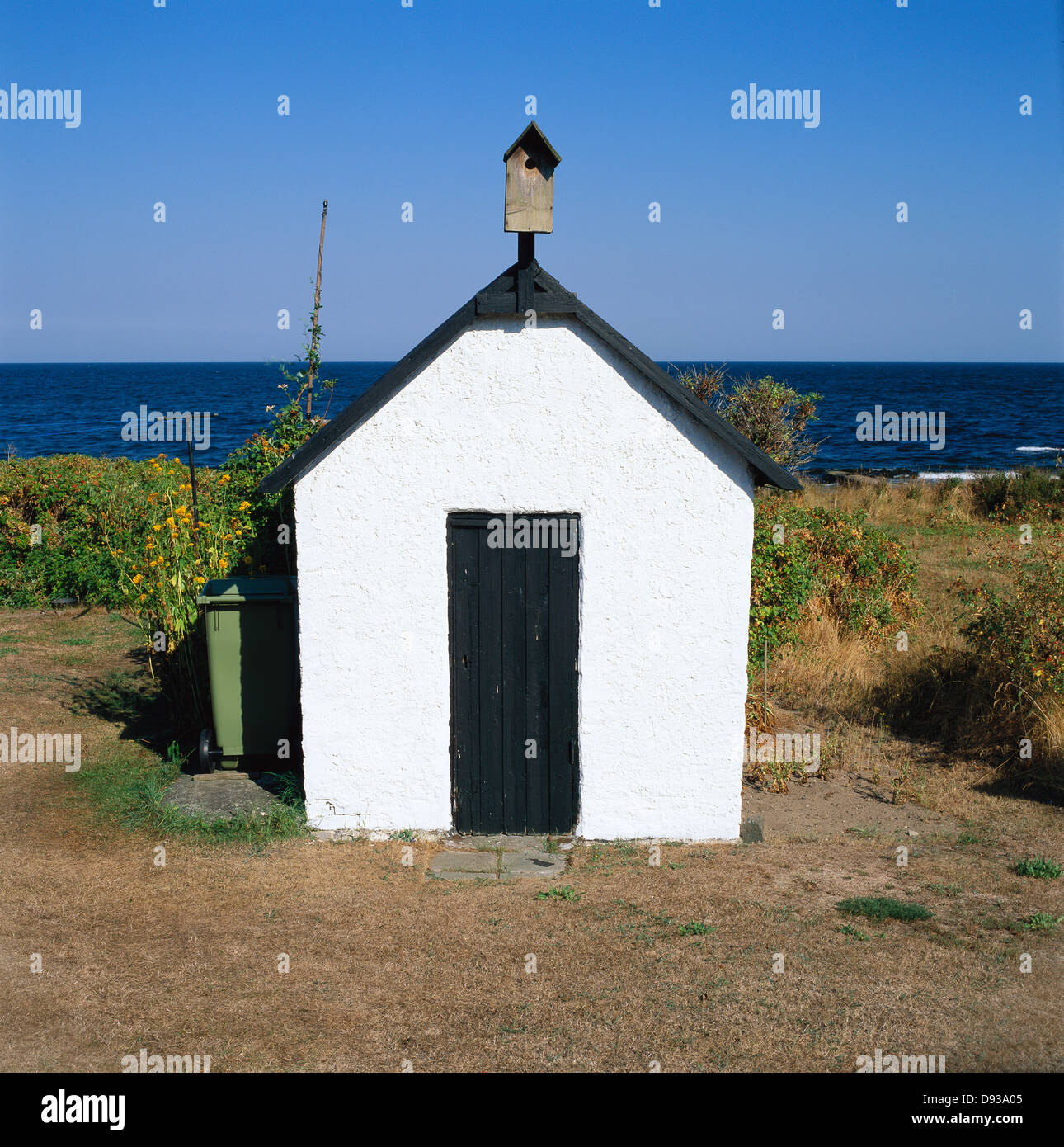 Small house by the sea Stock Photo - Alamy