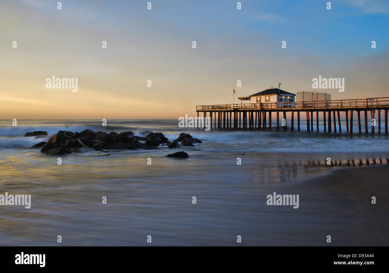 morning surf licking the shoreline and pastel blues paint the sky and ...