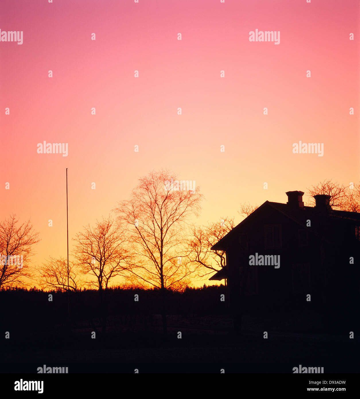 Evening light and house silhouette Stock Photo - Alamy
