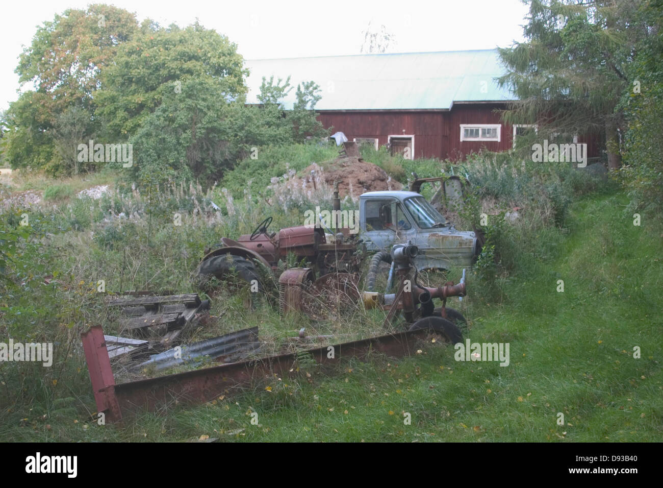 Metal scrap behind a barn, Sweden Stock Photo - Alamy