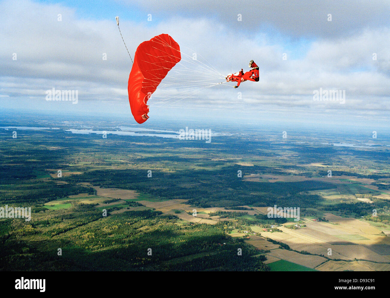 A red parachute in the blue sky, Sweden Stock Photo - Alamy