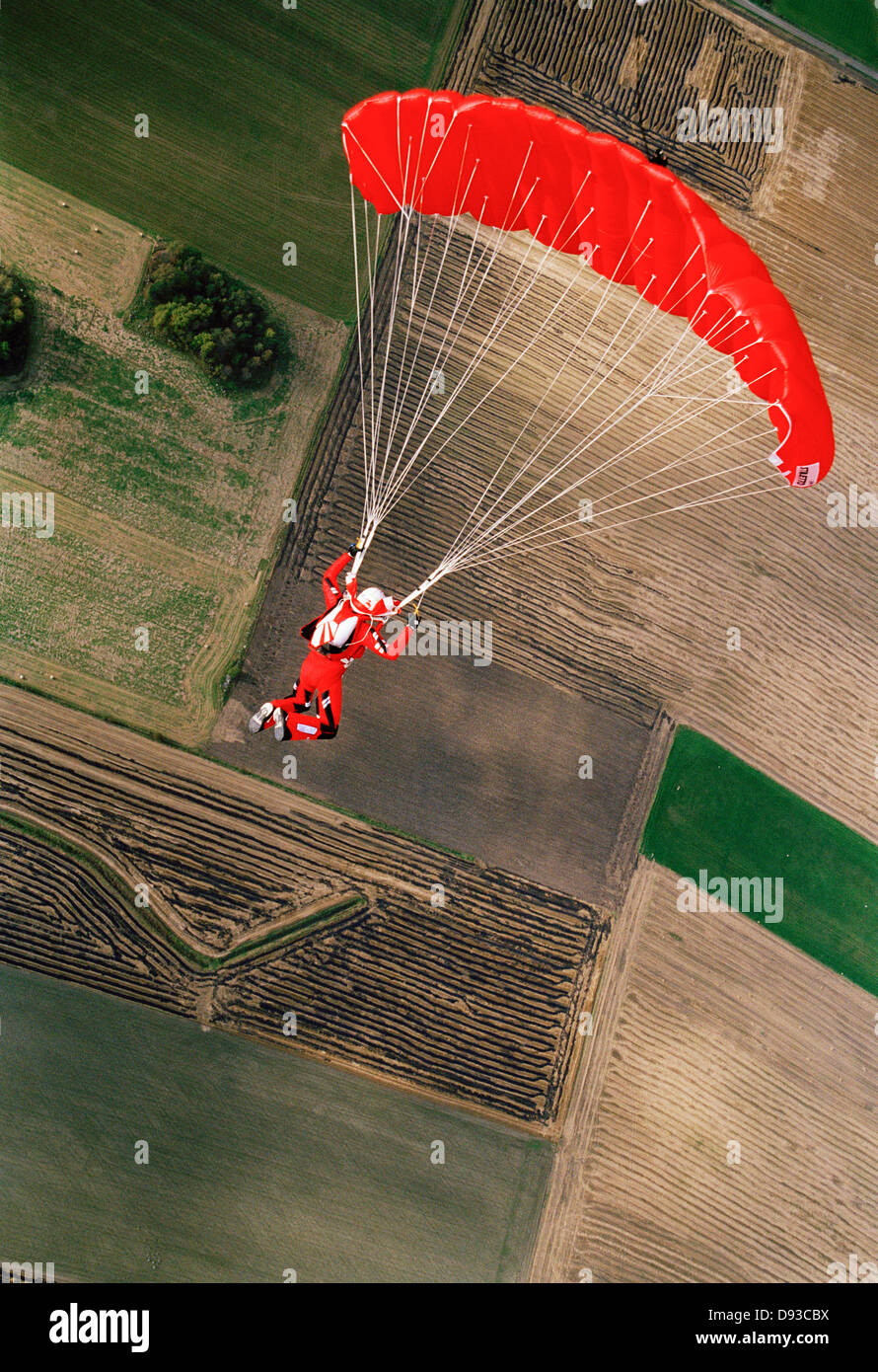 A red parachute over fields, Sweden Stock Photo - Alamy