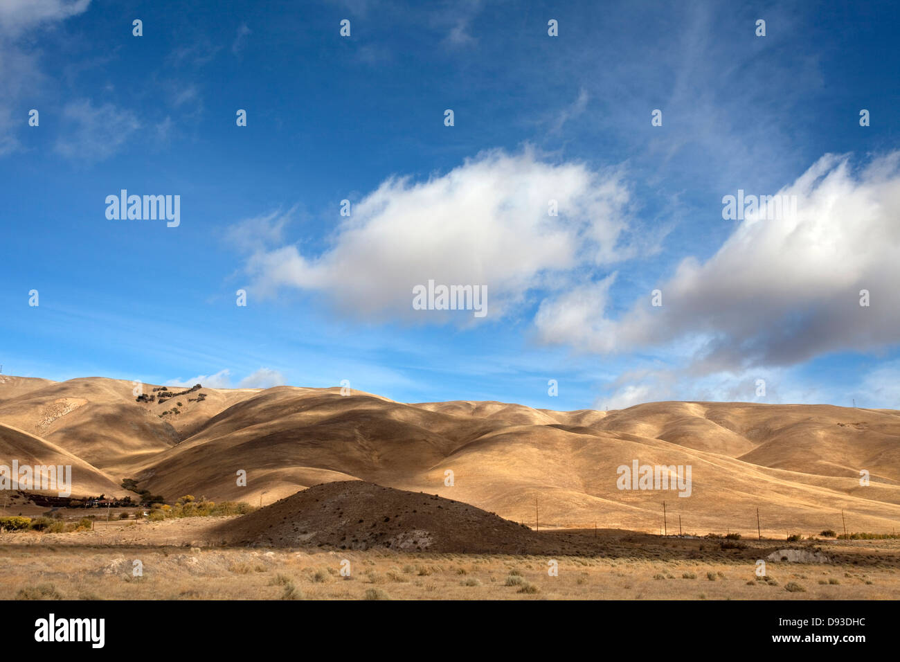 Clouds casting shadows over dry rural landscape Stock Photo - Alamy