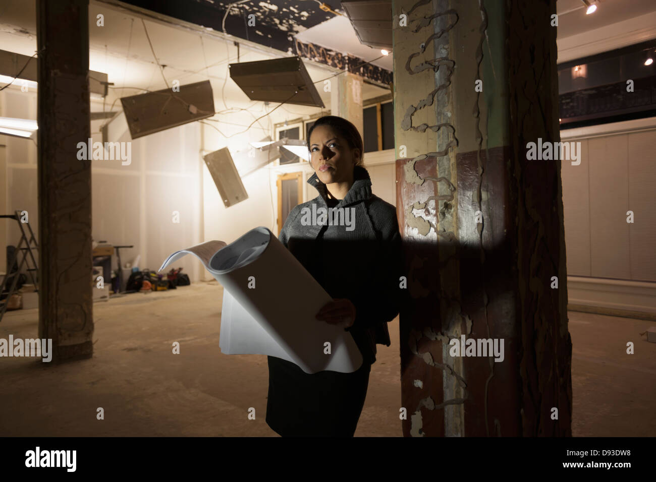 African American businesswoman reading blueprints Stock Photo - Alamy