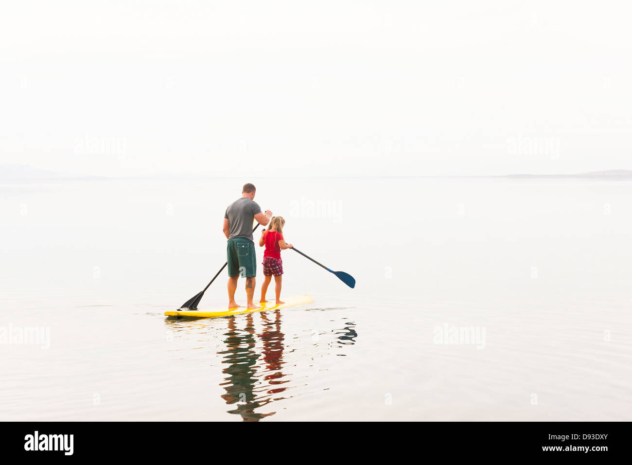 Girl paddle board parent hi-res stock photography and images - Alamy