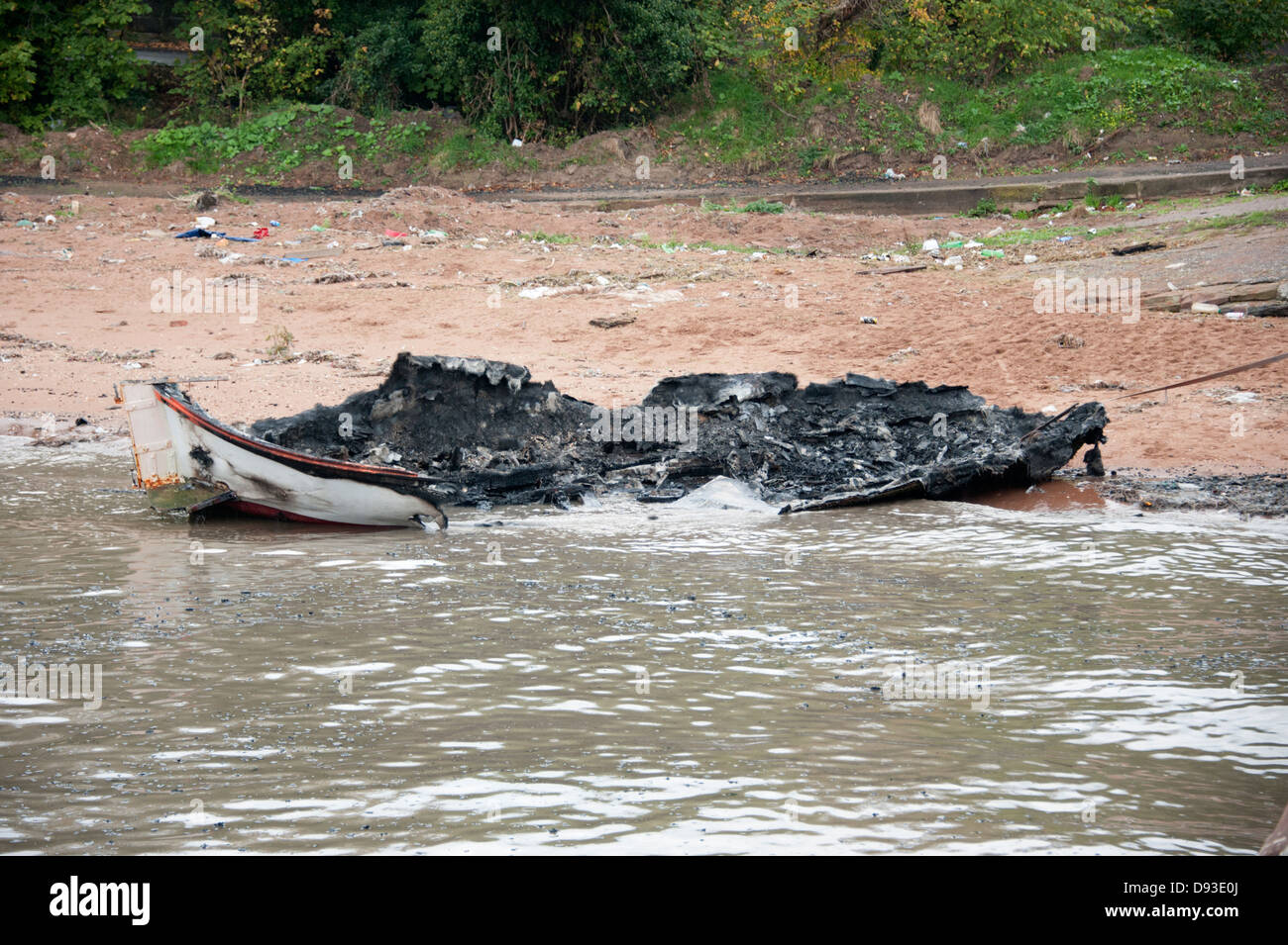 Burnt out Boat hull fire Stock Photo - Alamy