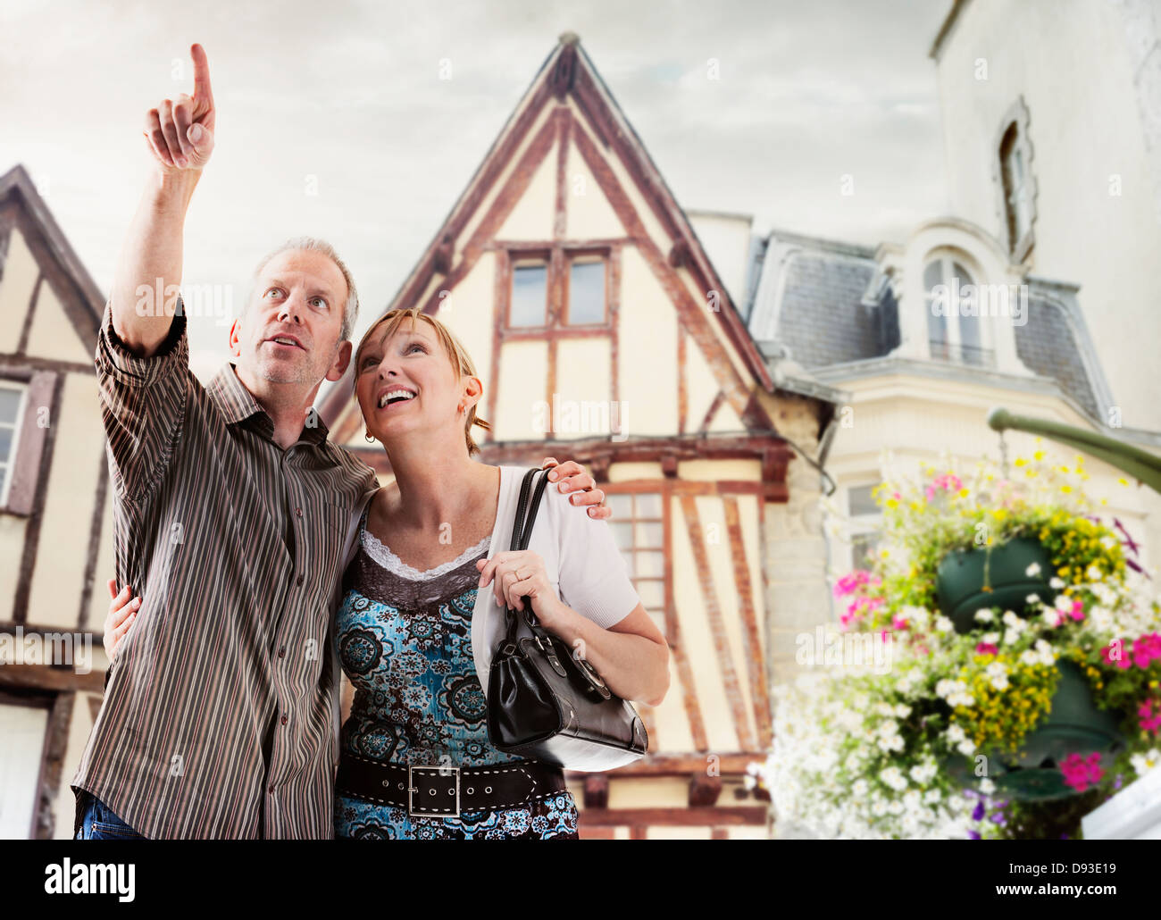 Caucasian couple exploring village together Stock Photo - Alamy