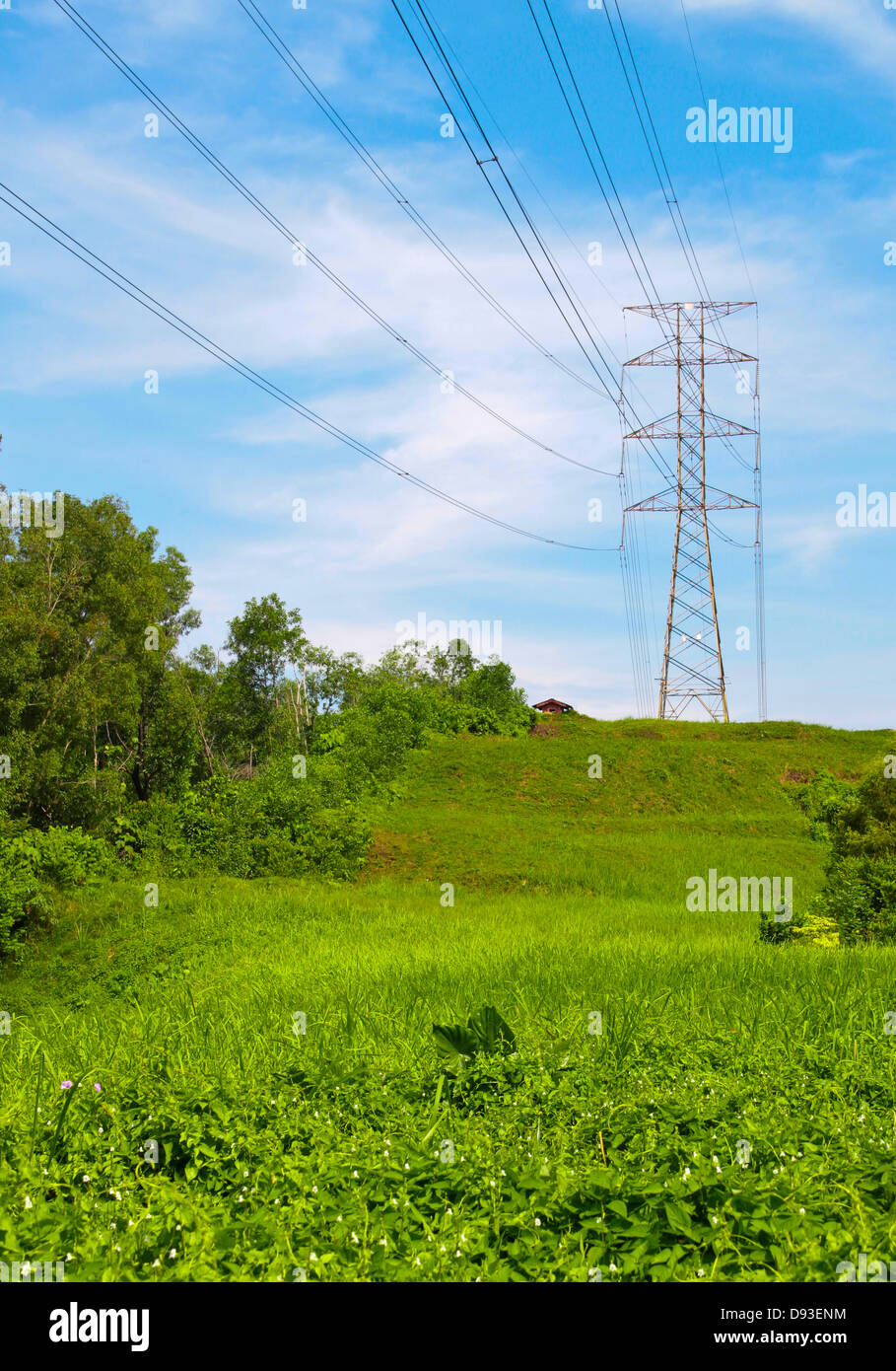 Power cable tower on a hill near housing area. Concept of power ...