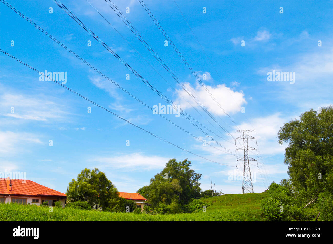 Power cable tower on a hill near housing area. Concept of power ...