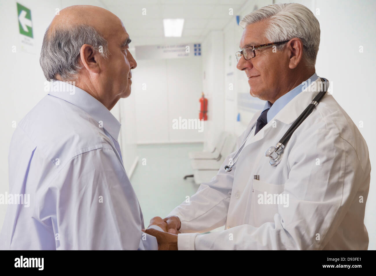 Hispanic doctor talking with patient Stock Photo - Alamy