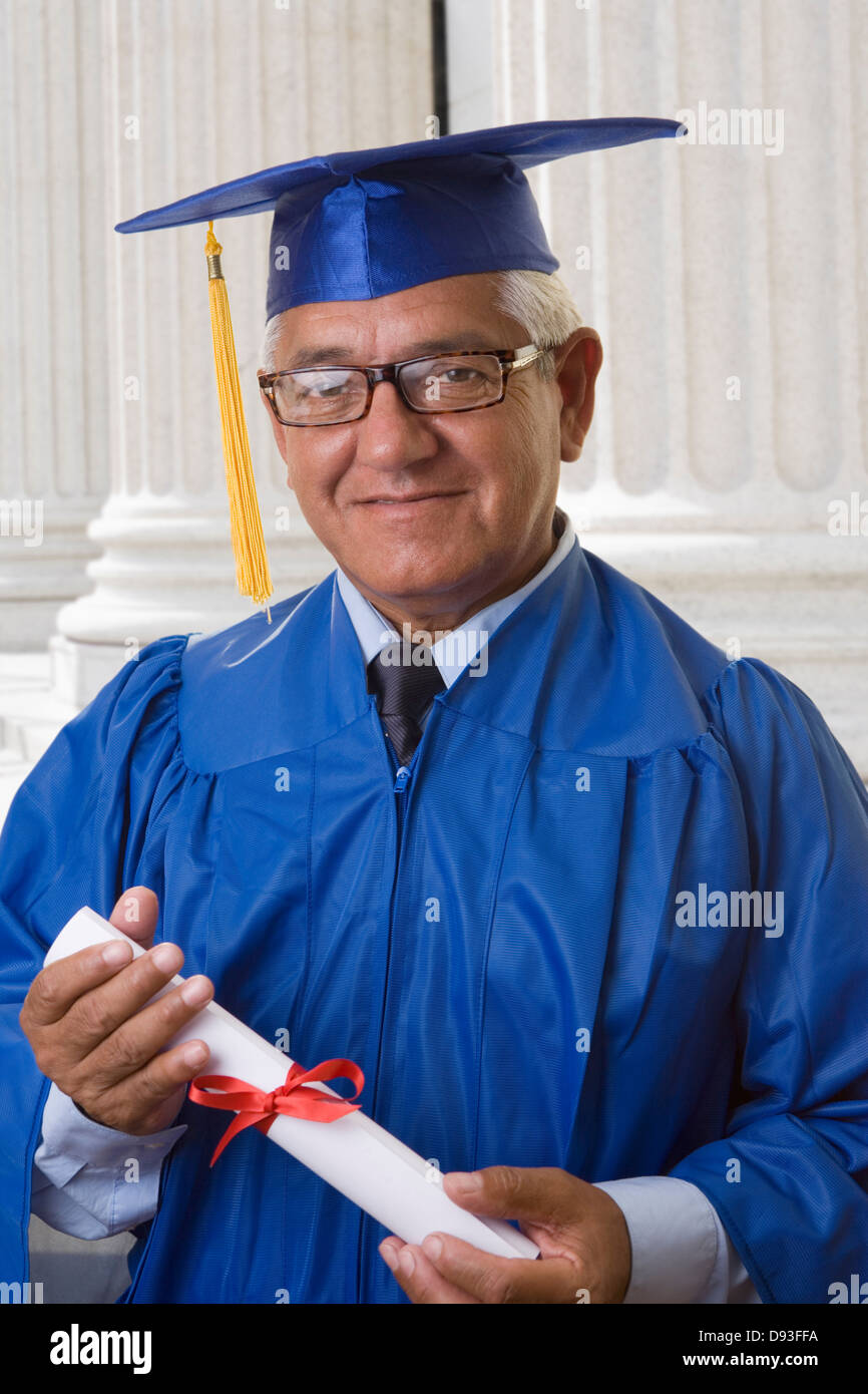 Hispanic man receiving college diploma Stock Photo - Alamy