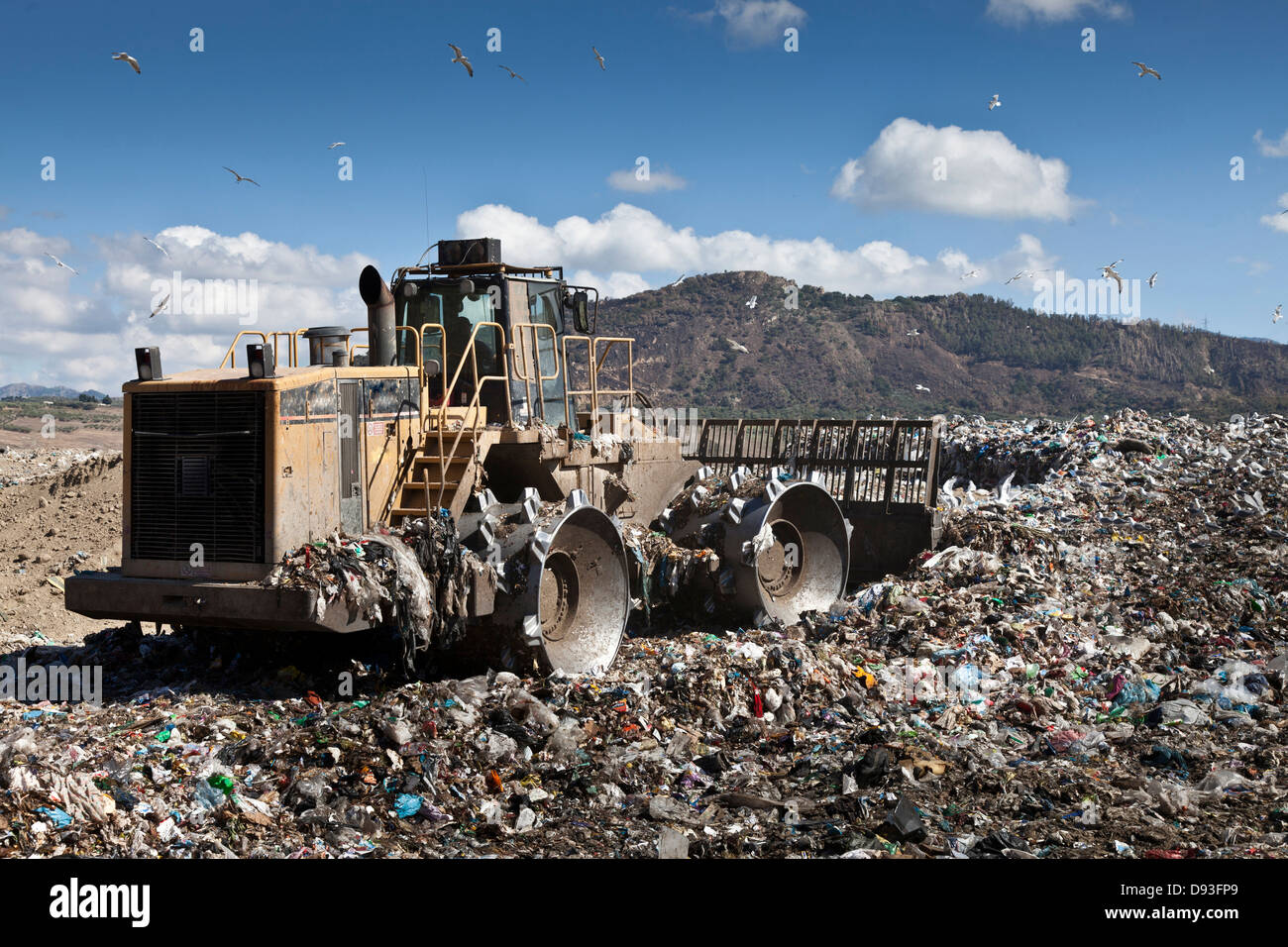 Machinery working in landfill Stock Photo - Alamy