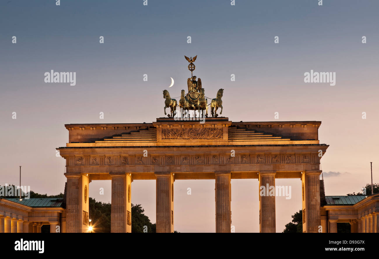 Columned building and statue lit up at night, Berlin, Germany Stock ...